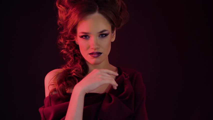 Portrait Of A Young Beautiful Girl In A Red Dress, Enlightening In Red ...
