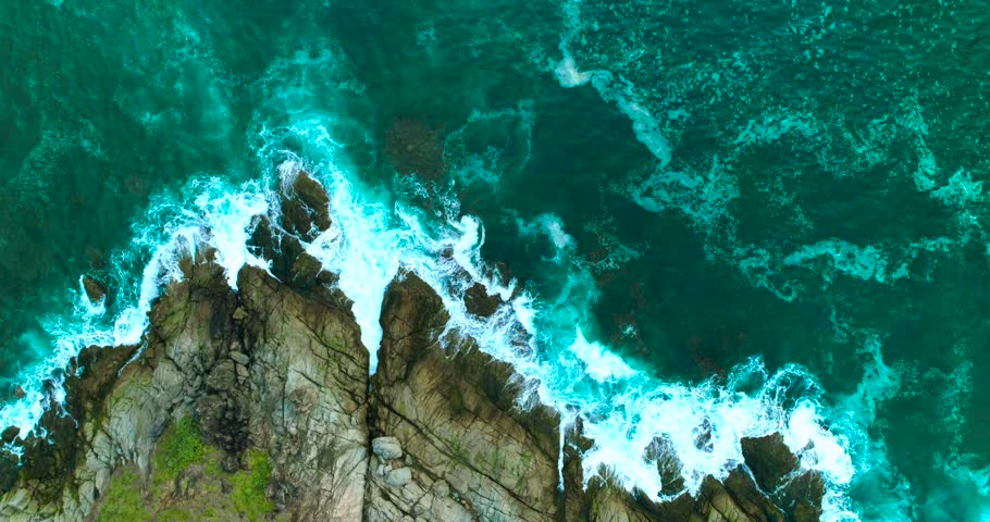 Waves washing over rocks on the shoreline image - Free stock photo ...