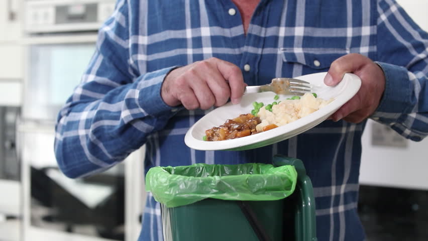 Man Scraping Food Leftovers Into Stock Footage Video (100% Royalty-free ...