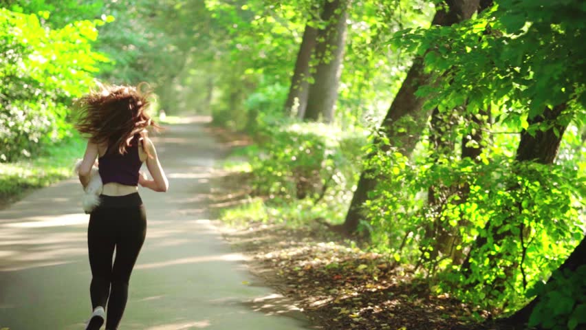 Girl Runs Through Park in Stock Footage Video (100% Royalty-free ...