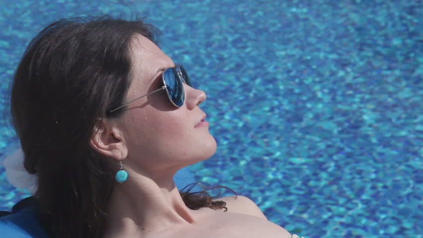 Seductive Girl At Poolside Touching Breasts Rubbing Neck Gently Stock