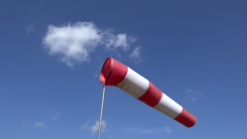 Windsock Indicating Strong Winds.White Clouds In The Background Of Wind ...