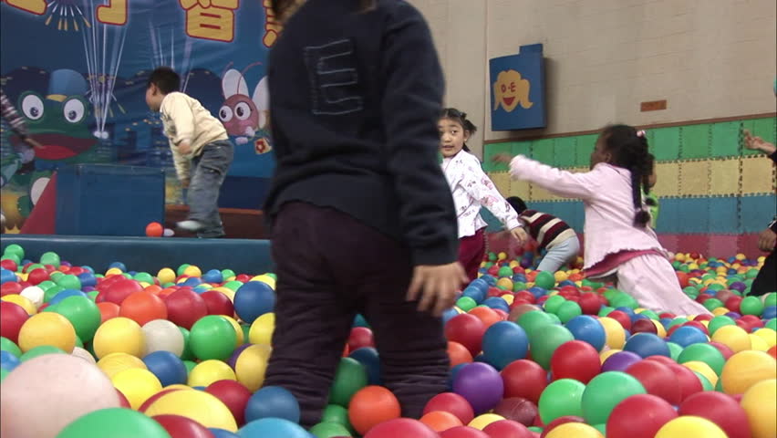 Beijing, China - February 2008: Chinese Kids Throwing Balls And Playing ...