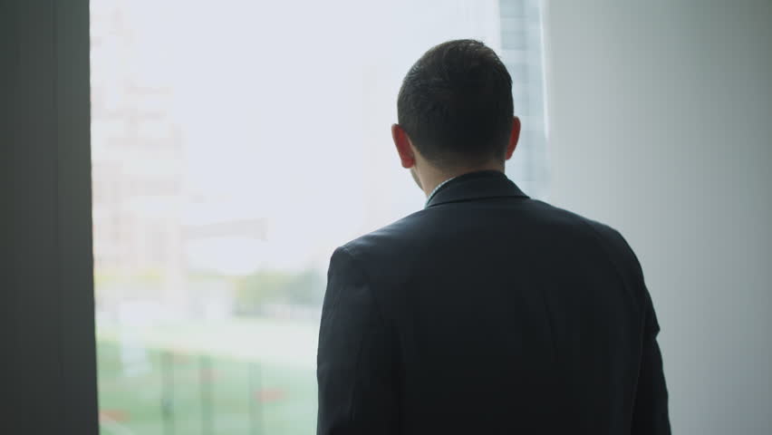 Man Watching Through Window. Person Silhouette Alone Sitting On Chair ...