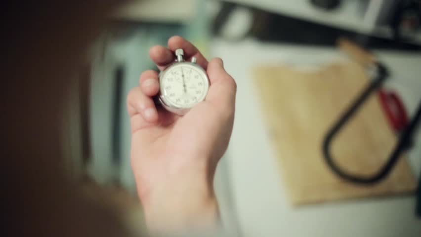 Passing Of Time. Hands Holding Fast Turning Clock. Saturated Grading ...