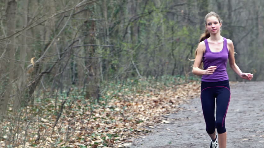 Stock video of sport girl runner is jogging on | 14960353 | Shutterstock