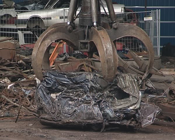 Pressed Piece Of Steel Handling With Special Equipment. Scrap Metal ...