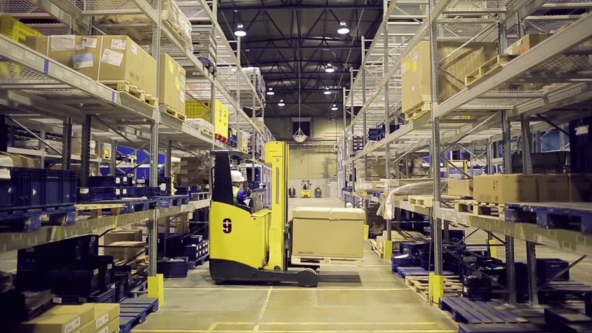 Warehouse Worker Loading Cargo On Rack. Close-up Of Container Stock ...