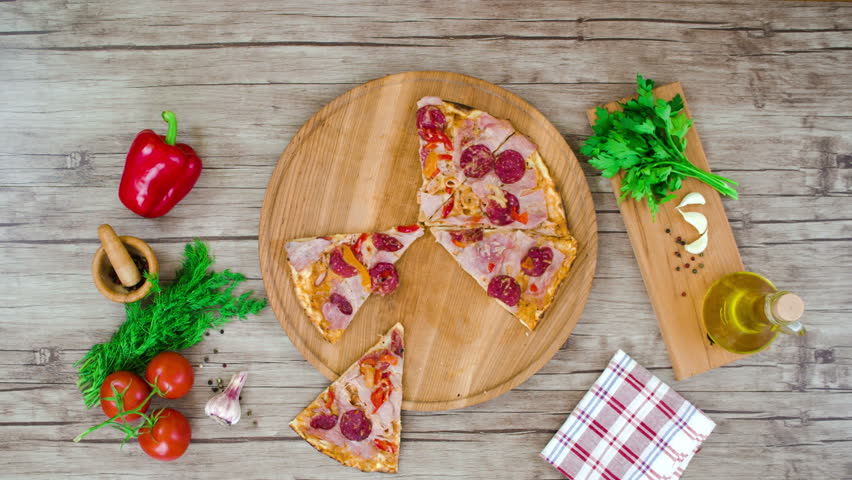 Top View Of Pizza With Ingredients On Wooden Plate On The Table - Stop ...