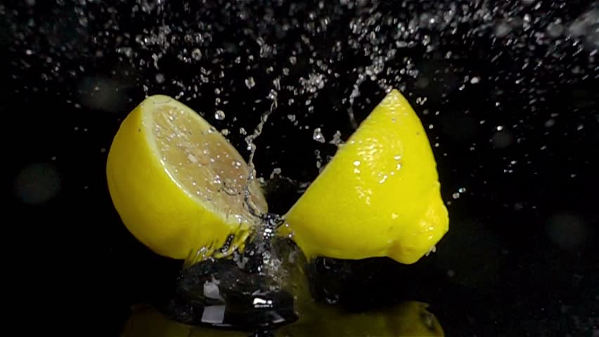 Fruit Splash,lemon Splashing On Water Breaking In Two Cuts Slow Motion ...