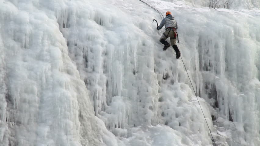 Man Ice Climbing Steep High Mountain Frozen Waterfall Ice In Utah ...