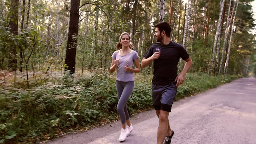 Two Young People Jogging Together Stock Footage Video (100% Royalty ...