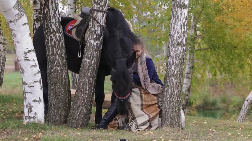 Girl Sitting On A Bench Among The Birch Trees In The Autumn With A ...