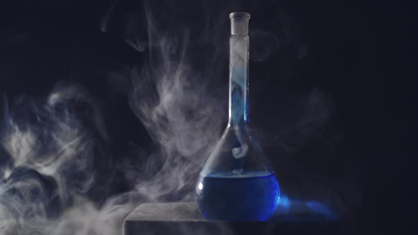 Chemistry Experiment With Smoke Coming From The Flask On A Black ...