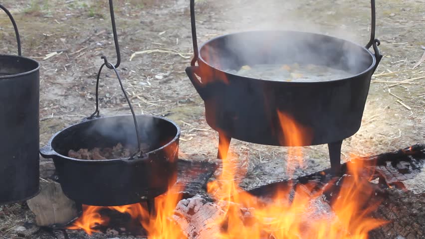Cooking Outdoors In Cast-iron Cauldron. Cooking On A Fire. Food In A ...