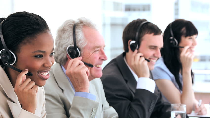 Stock video of happy business people working with headsets | 2301803 ...