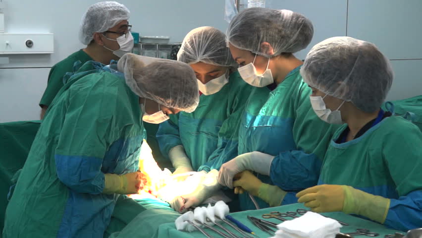 Surgeons Team Performing Surgical Operation, Cesarean Section In ...