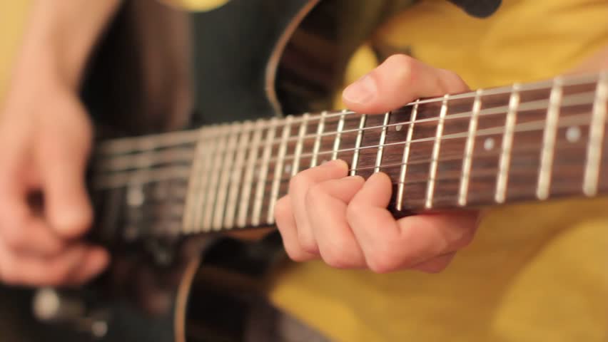 Stock Video Clip of Playing an electric guitar. Grief closeup ...