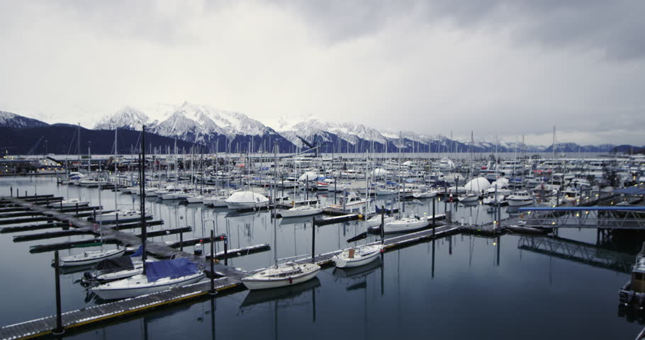 Boats in the harbor and Mountains in the Landscape in Seward, Alaska ...