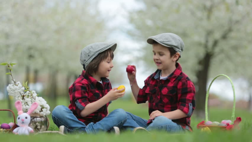 Two Children, Boy Brothers, Having Fun With Easter Eggs In The Park ...