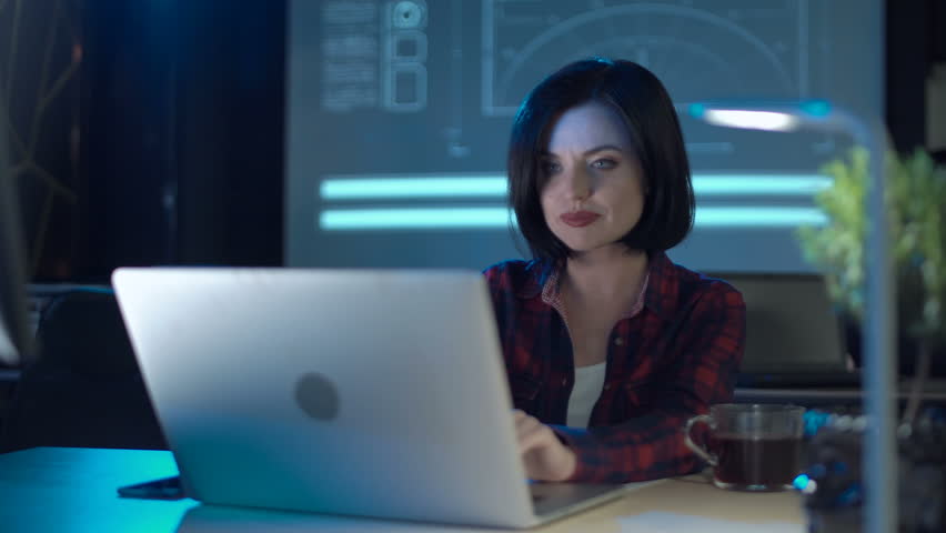 Computer Hacker Sitting In A Dark Room In Front Of Computer Screens ...