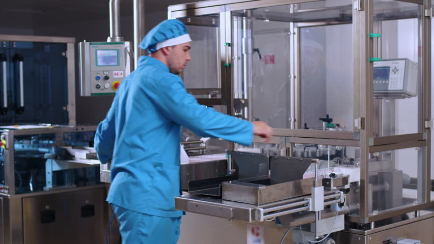 Operator CNC And Packaging Production/Worker Operates Industrial ...