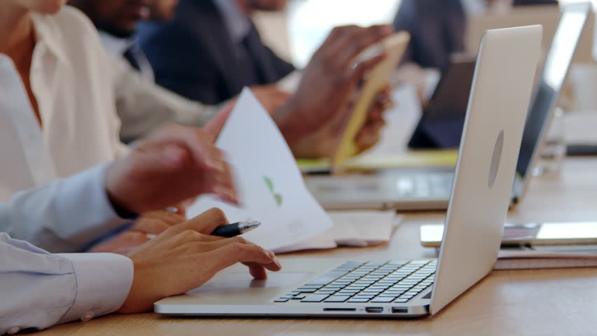 Seven Stylish Standing Diverse People Lean On A Conference Table While ...