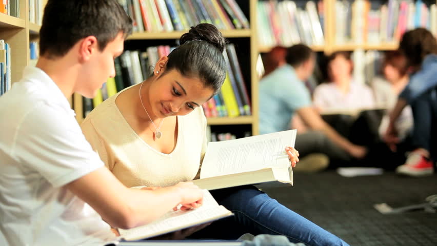 Teacher Passing Out Books In Library In High Quality 4k Format Stock ...