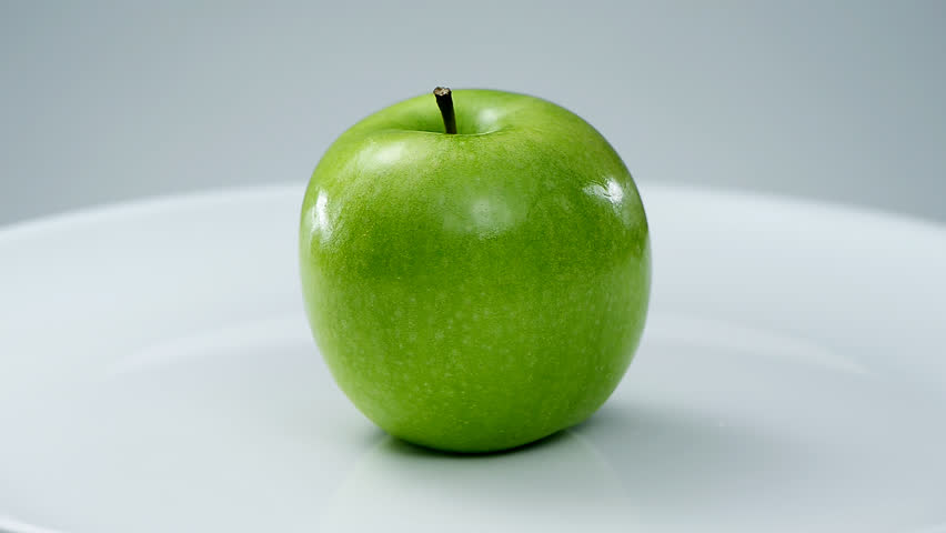 Green Apple Rotation On A White Background, Eating Apple Timelapse 4K ...