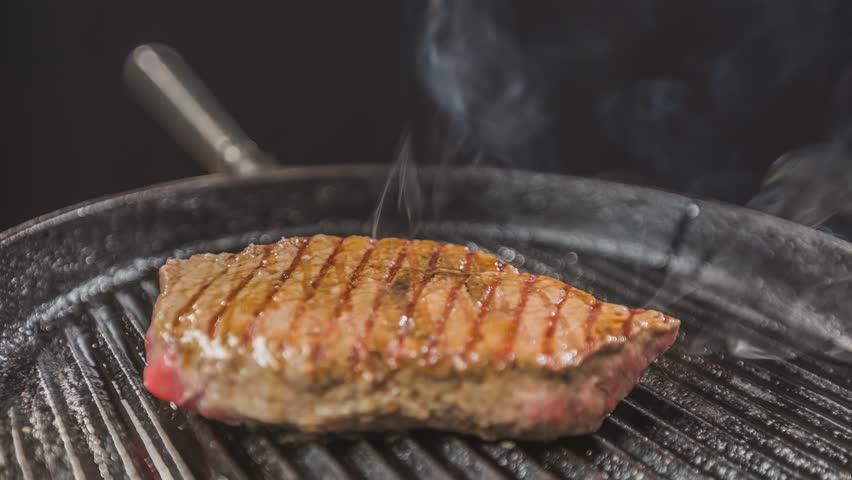 Stock video of timelapse video of a frying steak | 27501193 | Shutterstock