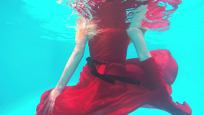 Young Blonde Girl In Long Red Dress Jumps Into The Swimming Pool ...