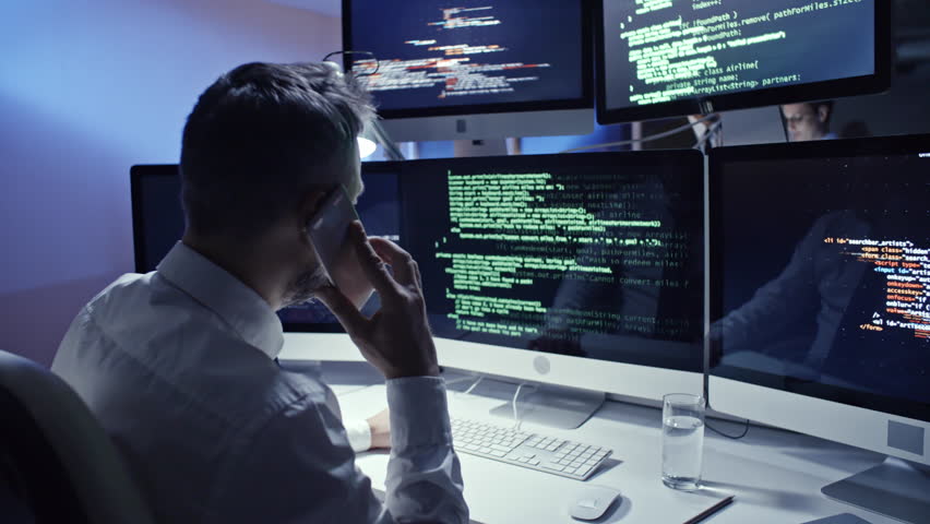 Experienced Male Cyber Security Professional Working On Multi-screen ...