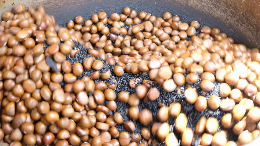 Cooking Edible Chestnuts On A Grill In The Asian Market Stock Footage ...