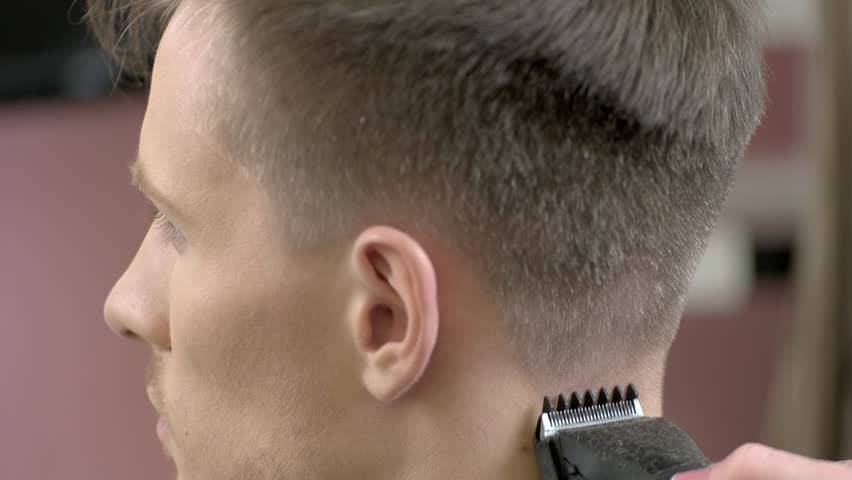 Stock Video Clip of Haircut, hand with hair clipper. Female barber ...