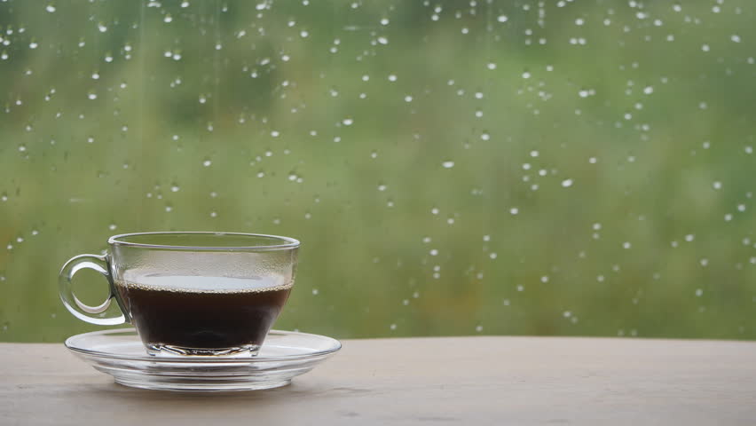Steaming Coffee Cup On A Rainy Day Window Background Stock Footage ...