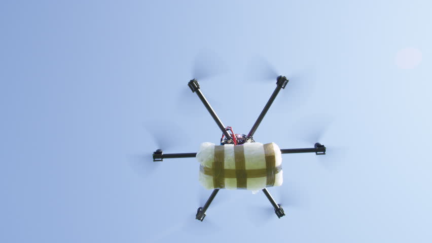 CLOSE UP: Drone Delivery Of Illegal Drugs. UAV Aircraft Flying Drug ...