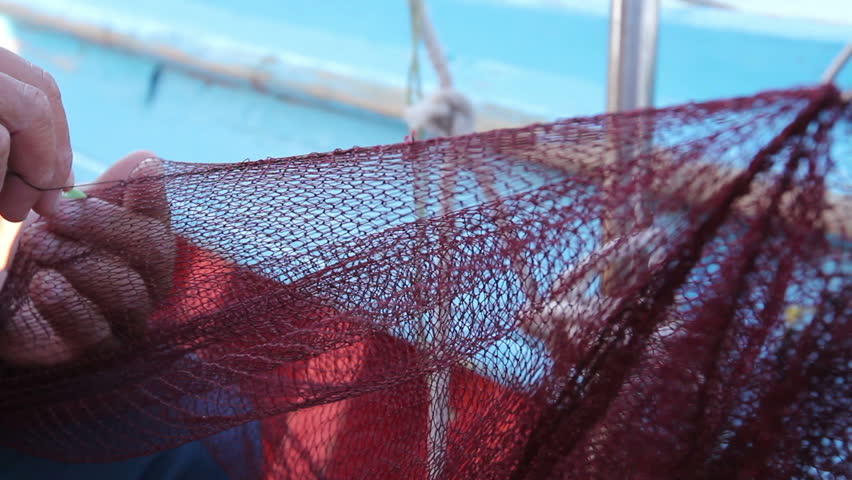 Fisherman mending a net Stock Video Footage - 4K and HD Video Clips ...