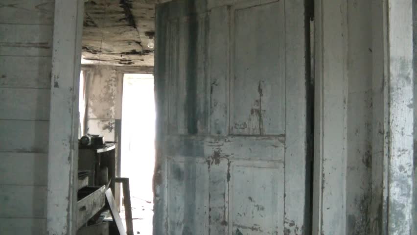 CLOSE UP Looking Through The Shattered Window Of An Old Ruined Decaying ...