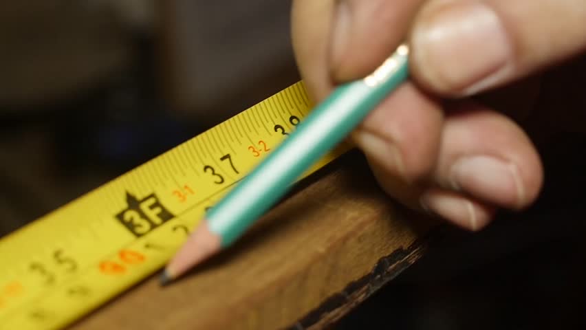 Carpenter Using Tape Measure and stock-videoer (100 % royaltyfri ...