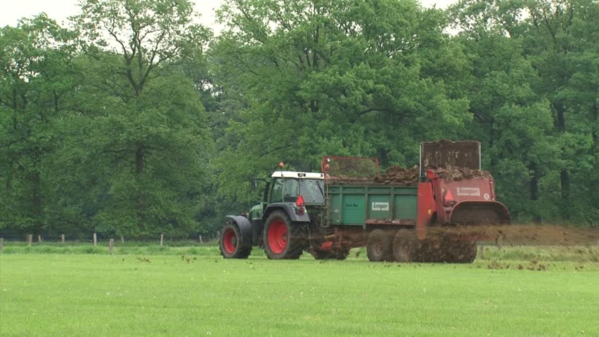 Farmer Spreading Organic Manure Across Stock Footage Video (100% ...