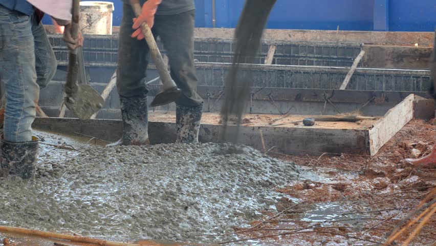 Pouring Concrete For The Base Of A New Water Tank. Construction In A ...