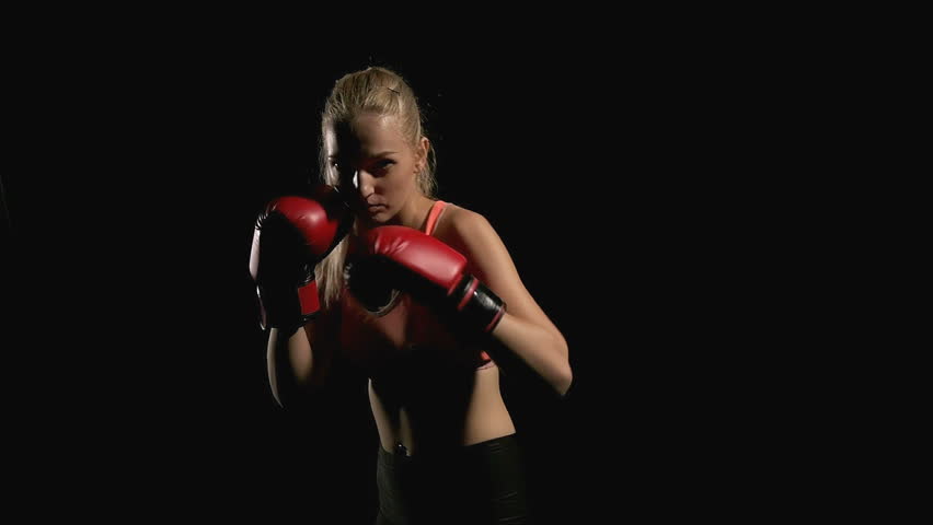 Young Intense Woman Throwing Punches. Punching Air. White Young ...
