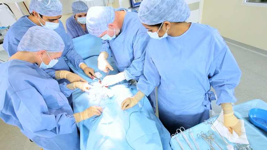 Multi Ethnic Surgical Team Performing Operation Sterilized Conditions ...