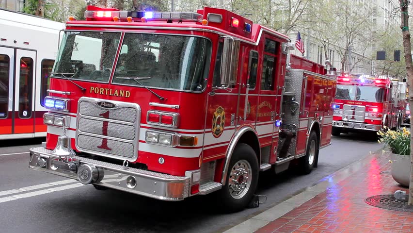 Side View Of Fire Engine Parked At Night, Lights Flashing While ...
