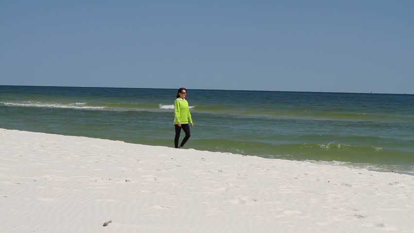 Woman Walks Along a Sandy Stock Footage Video (100% Royalty-free ...