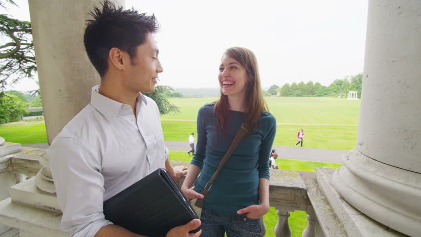 Students Flirting Together Outside On College Campus Stock Footage ...