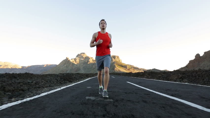 Stock video of man running on road in beautiful | 5798933 | Shutterstock