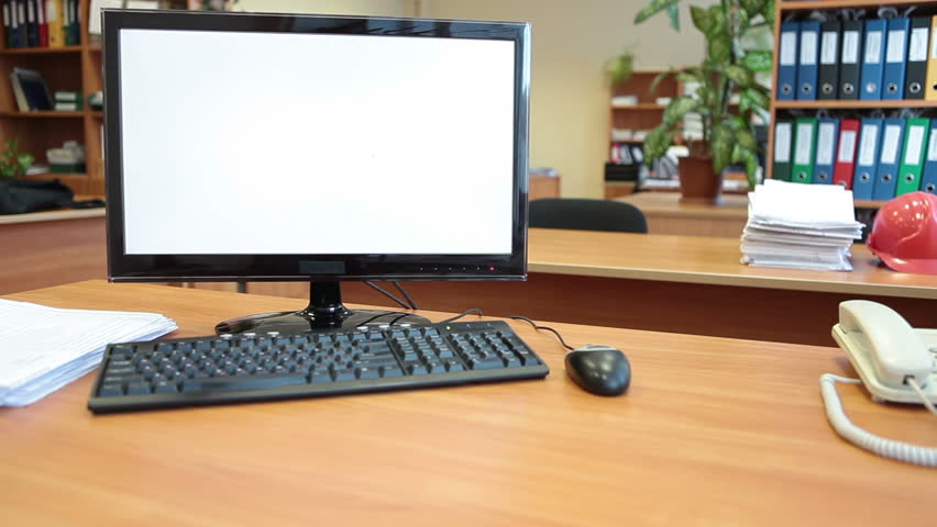 Office Worker Placing Paper Documents Before Computer Monitor At The ...