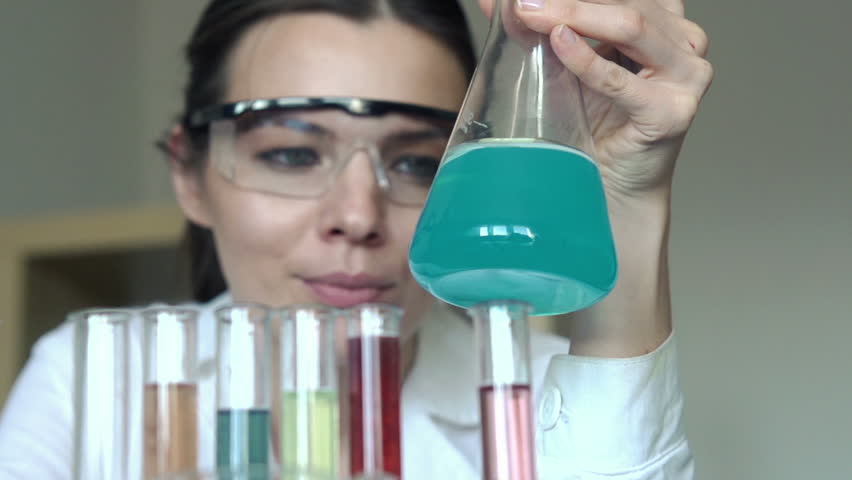 Stock video of chemist mixing chemicals in erlenmeyer flask, | 6065573 ...