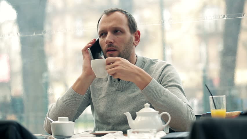 Stock video of young handsome man drinking tea and | 6095063 | Shutterstock